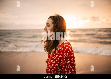 Woman at the seafront at sunrise, Miami, Florida, USA Stock Photo - Alamy