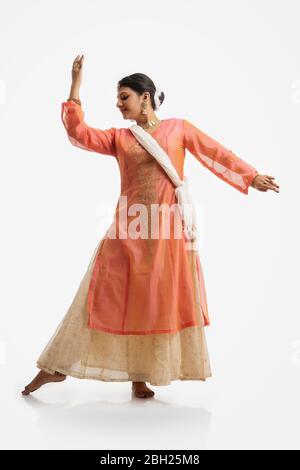 Graceful kathak dancer performing over a white background Stock Photo ...