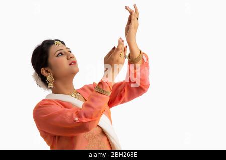 Beautiful kathak dancer performing over a white background Stock Photo ...