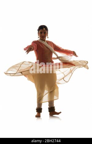 Beautiful kathak dancer performing over a white background Stock Photo ...