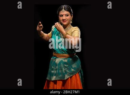 Beautiful kathak dancer performing over a white background Stock Photo ...