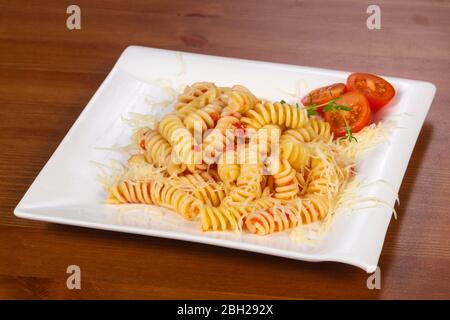 Italian springs pasta with tomato sauce and cheese Stock Photo - Alamy