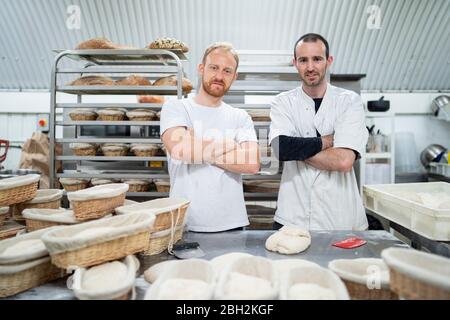 portrait of two bakers in bakery Stock Photo - Alamy