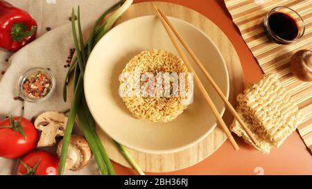 Instant noodles with king mushrooms, seasonings, soy sauce, peppers ...