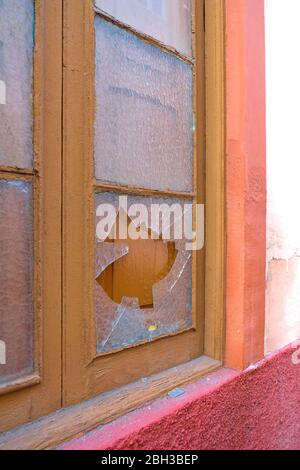 Smashed window with broken window pane Stock Photo - Alamy