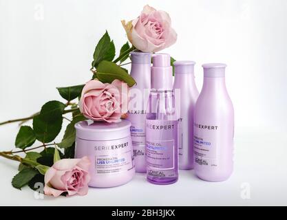 Hair brush and cosmetics on light background Stock Photo - Alamy