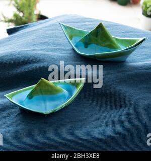colorful ceramic ships, paper origami handcraft Stock Photo - Alamy