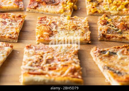 Homemade pizza on baking paper close up Stock Photo - Alamy