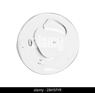 Transparent skin care liquid texture. Yellow serum and bubbles on white ...