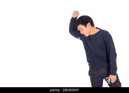 The photo of An Asian man is smashing thing with one hand on white ...