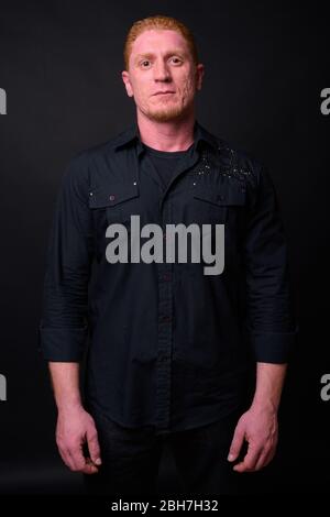Portrait of muscular man with orange hair Stock Photo - Alamy