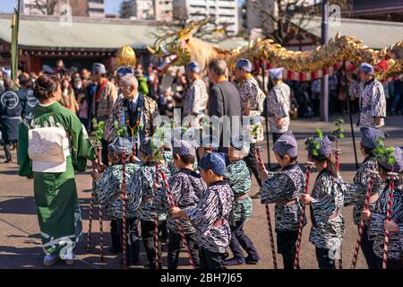 Suzu or Golden bell in Japanese shrine hanging under the eaves of a ...
