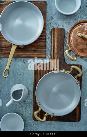 Different types of empty bowls on an old wooden background in brown ...
