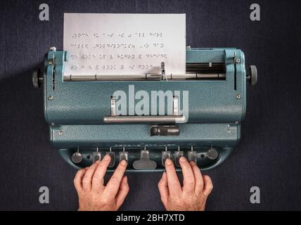 A woman typing in braille using a Perkins Brailler typewriter Stock ...