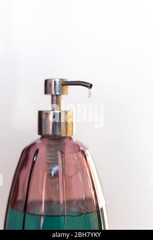 A dripping soap dispenser Stock Photo - Alamy