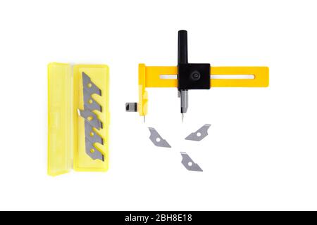 Rotary compass cutter with a set of spare blades Stock Photo - Alamy