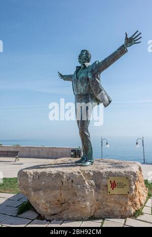 View of the Domenico Modugno bronze statue in Polignano a mare Stock ...