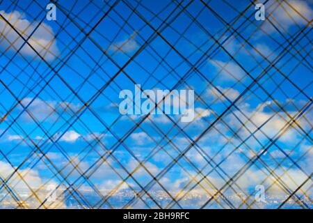 Clouds behind a grid Stock Photo - Alamy