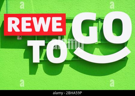 Facade with sign and logo of Rewe Stock Photo - Alamy