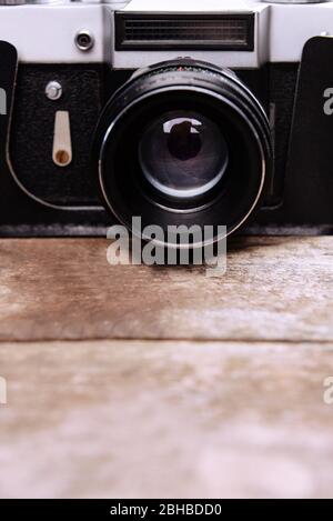 Old retro camera on rustic wooden planks background Stock Photo - Alamy