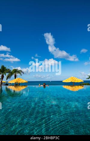 The Caribbean, Anguilla. Woman in the pool at Malliouhana Hotel Stock ...