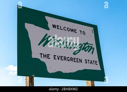 A roadside welcome to Washington The Evergreen State sign in Spokane ...