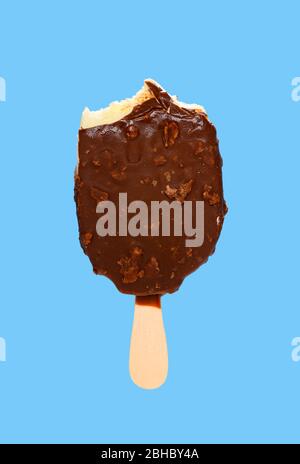 white popsicle with some bites on blue background Stock Photo - Alamy