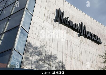A logo sign outside of a Neiman Marcus retail store location in ...