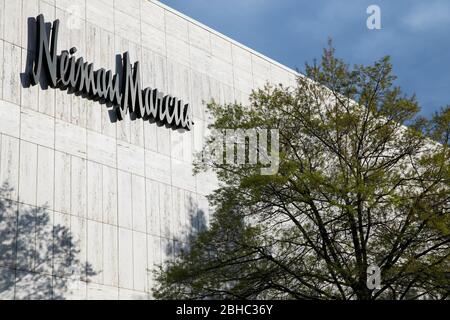 A logo sign outside of a Neiman Marcus retail store location in ...