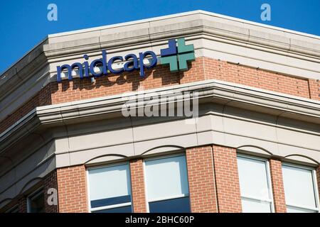 A logo sign outside of the headquarters of MidCap Financial Services in ...