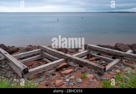 Breakwater in North Rustico Harbor, PEI, CA. Cribwork and riprap along ...