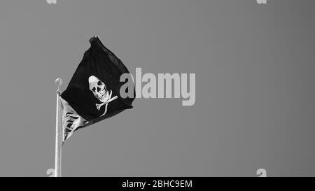 Skull and Crossbones flag, also known as Jolly Roger Stock Photo - Alamy