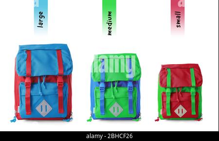School backpacks of different sizes on white background Stock Photo - Alamy