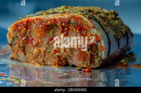 Boneless pork loin joint tied with string on the oven tray, raw meat ...