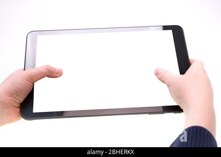 Kid hands holding white tablet computer on light blue background Stock ...