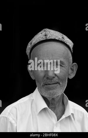 Portrait of a visitor at The Grand Mosque in Kuqa, Xinjiang, China ...