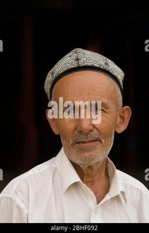 Portrait of a visitor at The Grand Mosque in Kuqa, Xinjiang, China ...