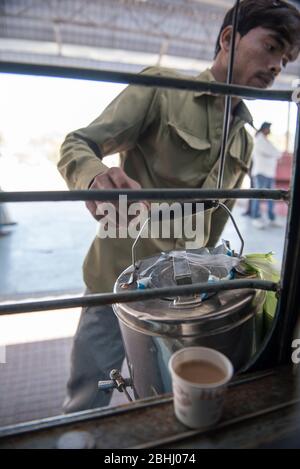 Mahoba / India 26 February 2017 Indian railway vendor selling tea to ...
