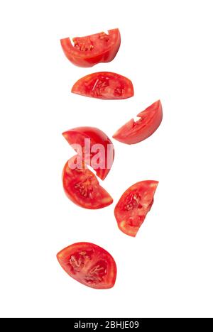 Whole tomato with half and a quarter slice isolated on white background ...