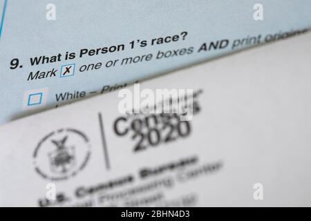 A photograph of the United States 2020 Census questionnaire and other ...