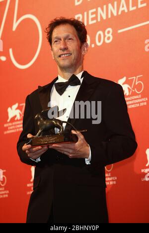Actor Tim Blake Nelson poses for photographers upon arrival at the ...
