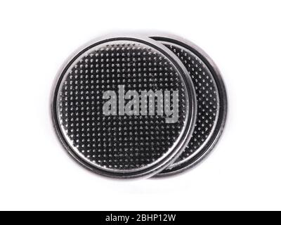 Flat lithium round button cell battery isolated over white background ...