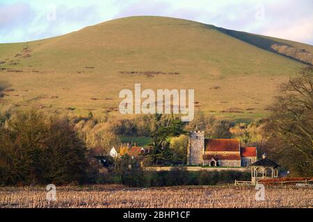 Beddingham church and Mount Caburn Iron Age fort in the South Downs ...