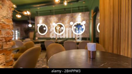 Cute restaurant interior with sofas and wooden tables Stock Photo - Alamy