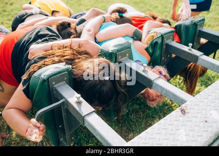 A group of women training to scrum against a machine on the training ...