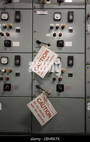 Caution warning signs on switchgear controls in Inverkip Power Station ...