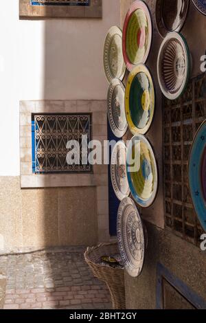 Decorative Moroccan plates displayed on a blue door Stock Photo - Alamy