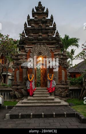 Hindu temple entrance gates with wooden carved doors and dvarapala ...