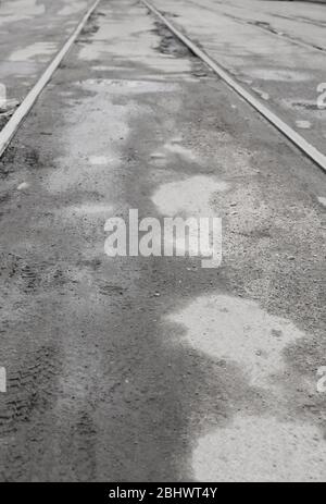 Very bad quality road with potholes and puddles Stock Photo - Alamy