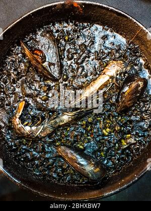 Paella is a Spanish squid ink rice dish originally from Valencia ...